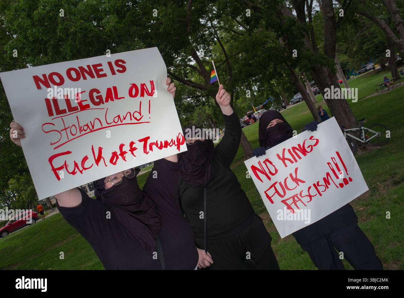 June 14, 2025, Manhattan, Kansas, USA: Protesters line Poyntz Avenue in ...