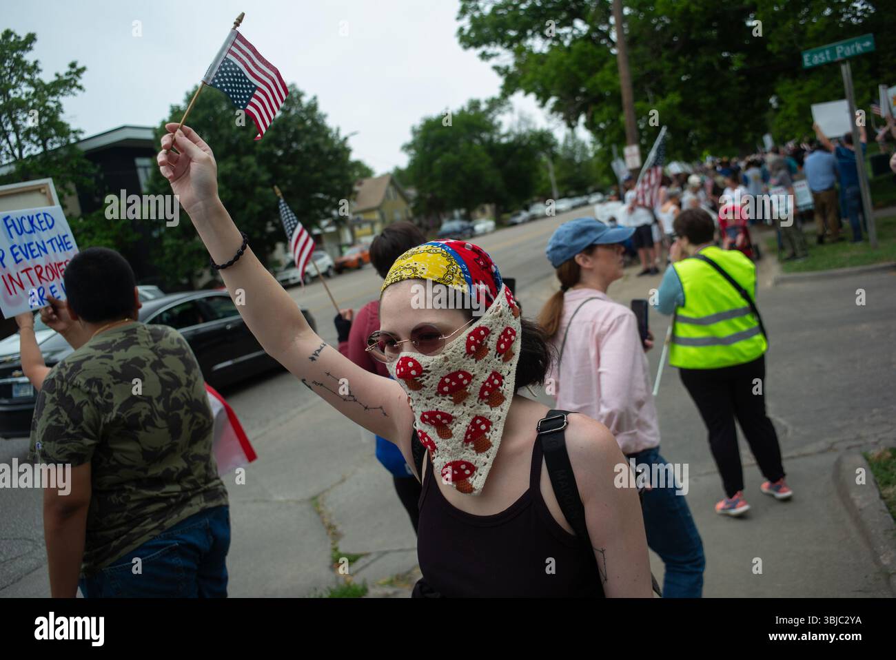 June 14, 2025, Manhattan, Kansas, USA: Protesters line Poyntz Avenue in ...