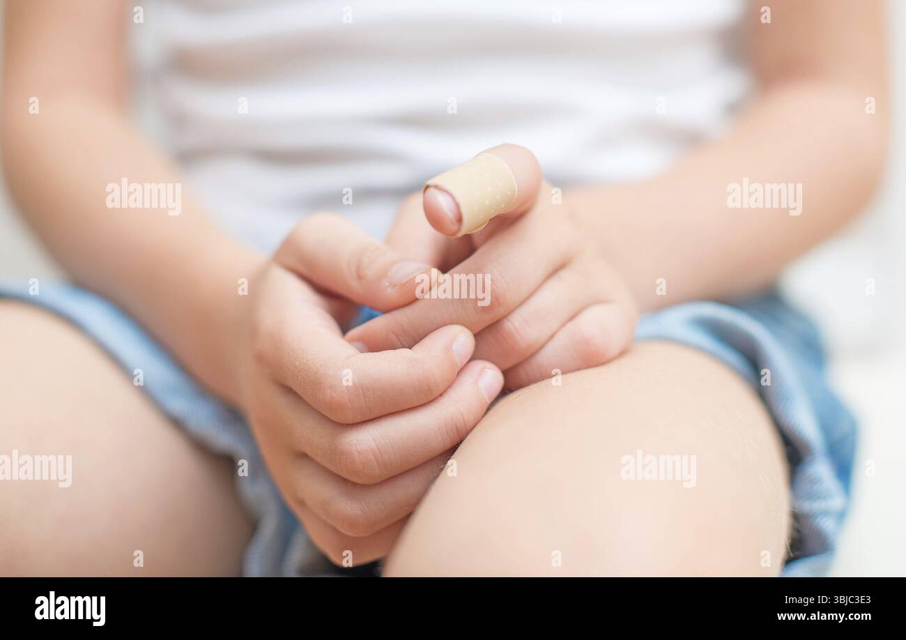 Child finger with an adhesive bandage Stock Photo - Alamy