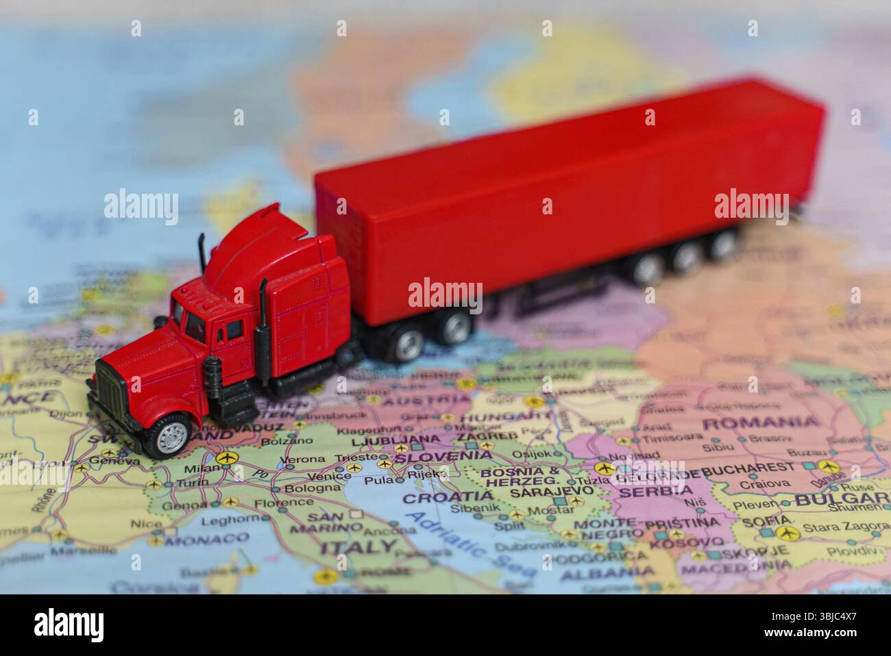 Truck with trailer on the Europe map Stock Photo - Alamy