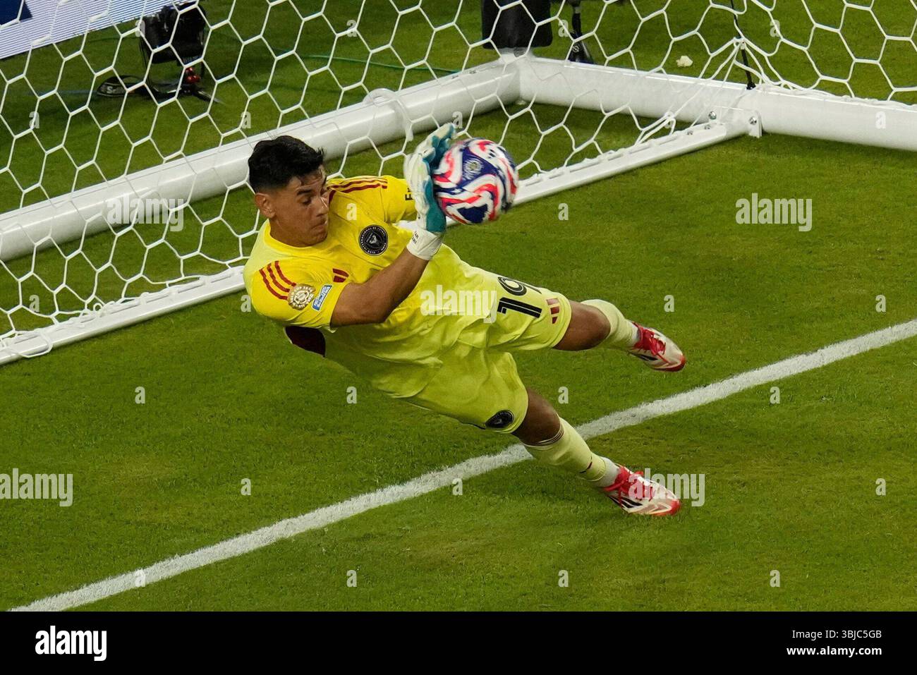 Inter Miami's Oscar Ustari saves a penalty from Al Ahly's Trezeguet ...