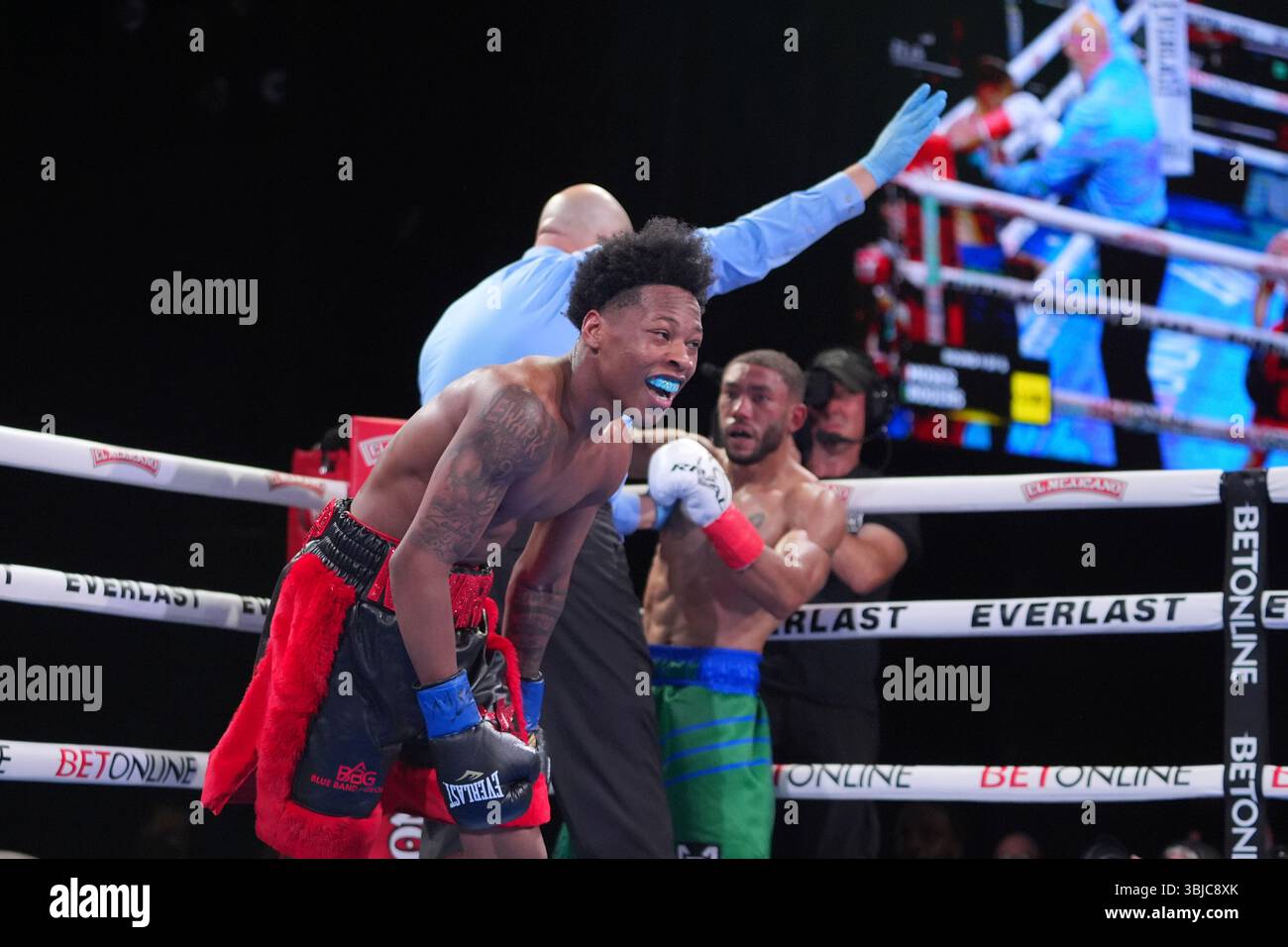 Zaquin Moses celebrates after stopping Carl Rogers during the fourth ...