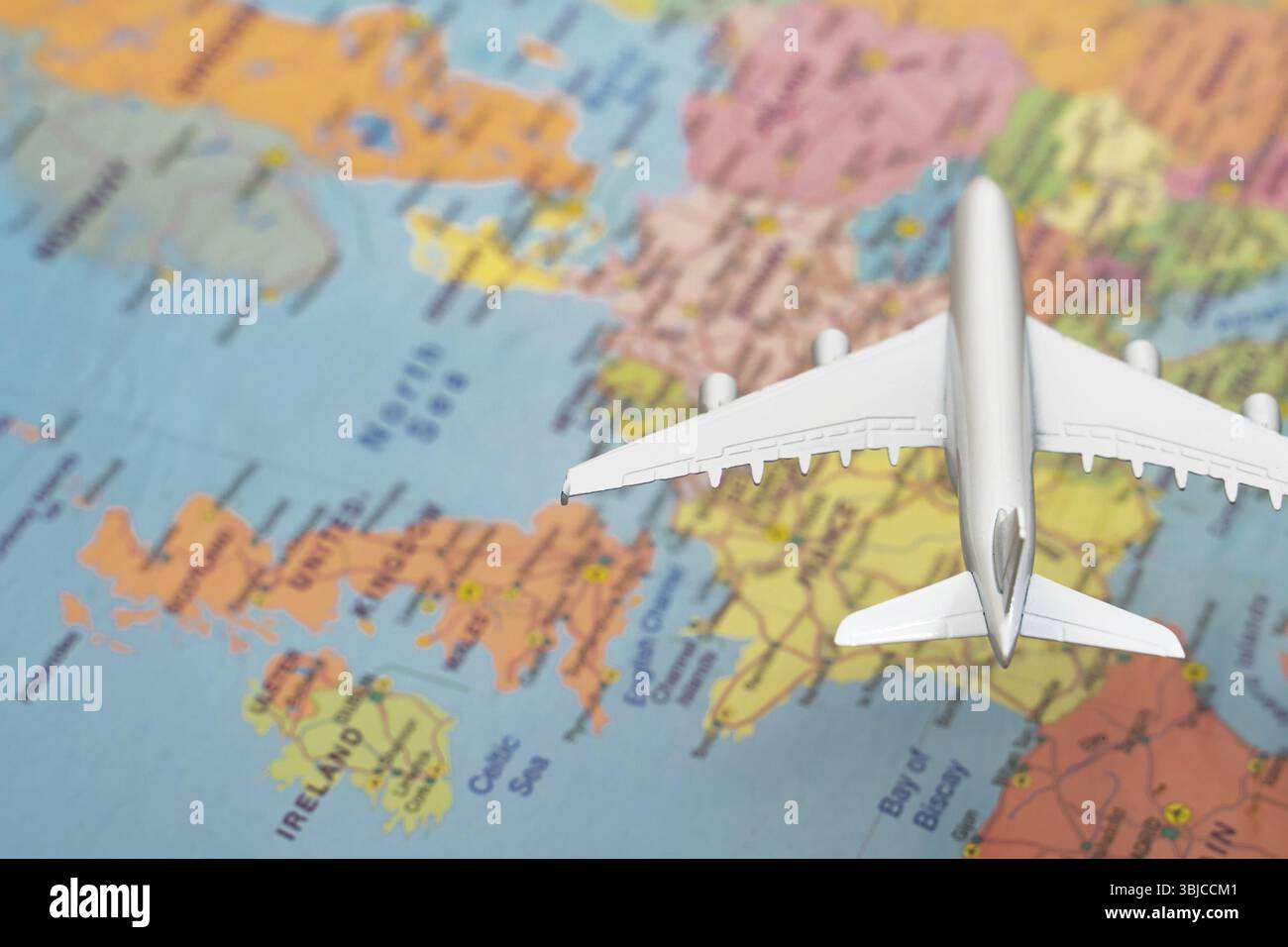 Toy of a plane flying over the Europe map Stock Photo - Alamy