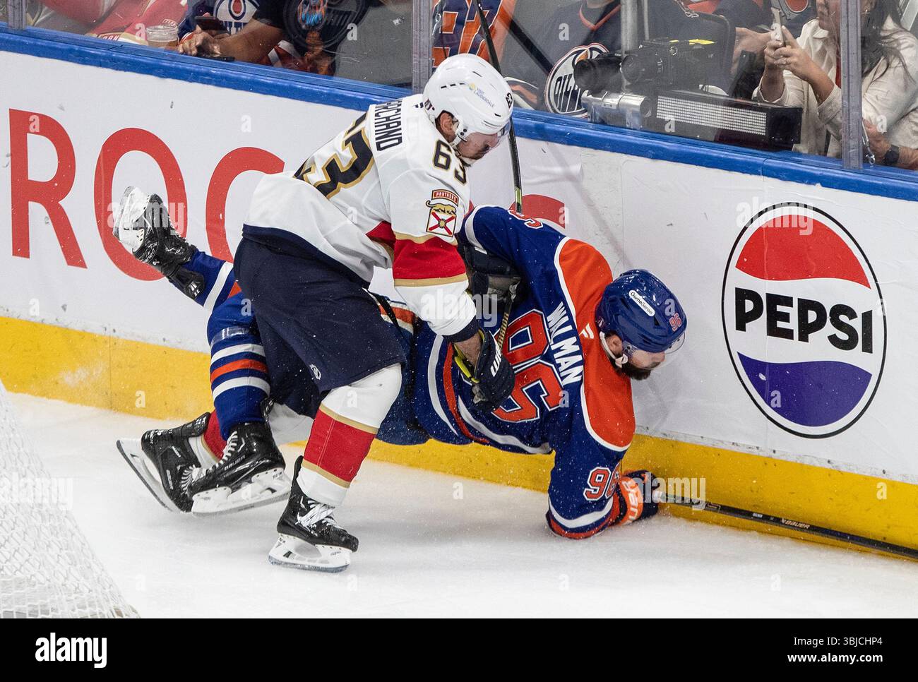 Florida Panthers' Brad Marchand (63) checks Edmonton Oilers' Jake ...