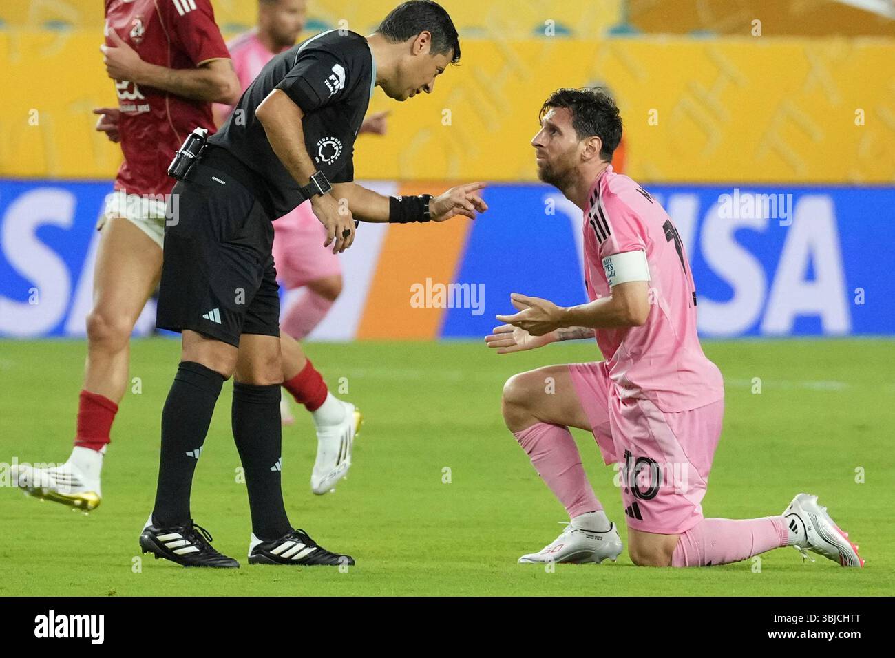Inter Miami's Lionel Messi, right, protests referee Alireza Faghani ...