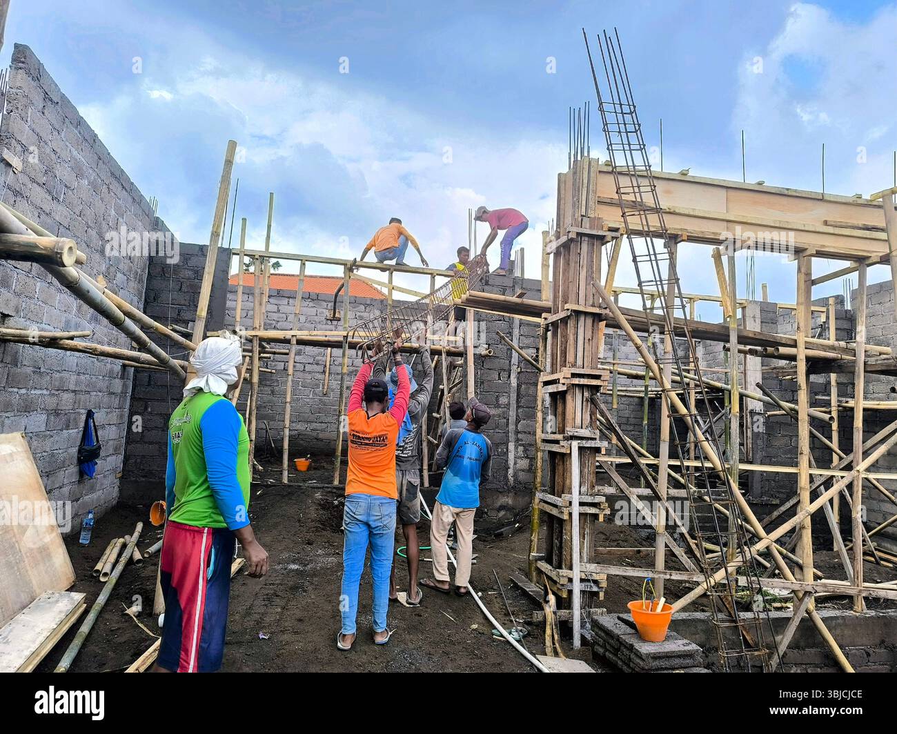 Canggu, Bali, Indonesia, May 22, 2025: Construction workers are ...