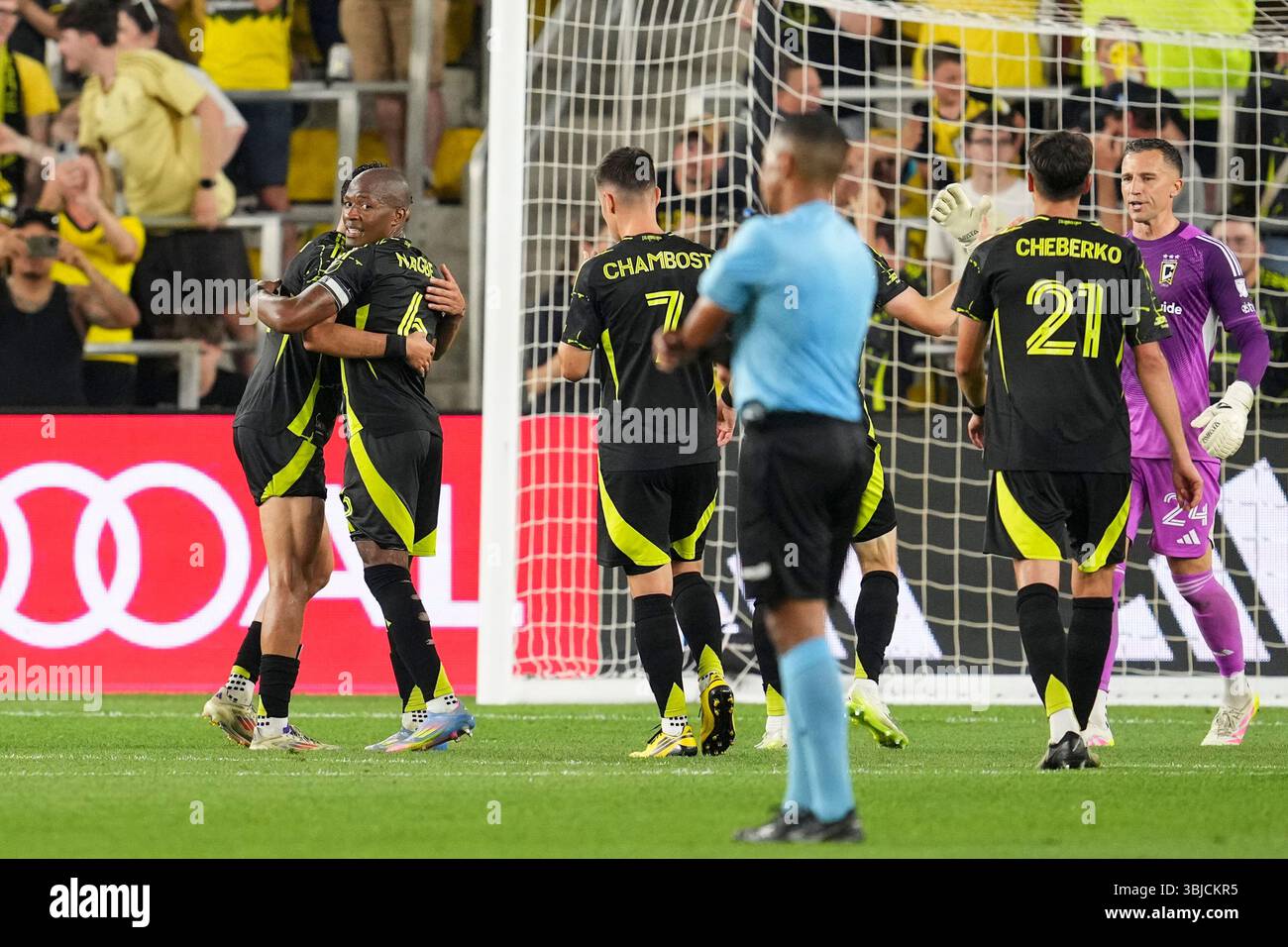 Columbus Crew's Darlington Nagbe (6) embraces teammate Marcelo Herrera ...