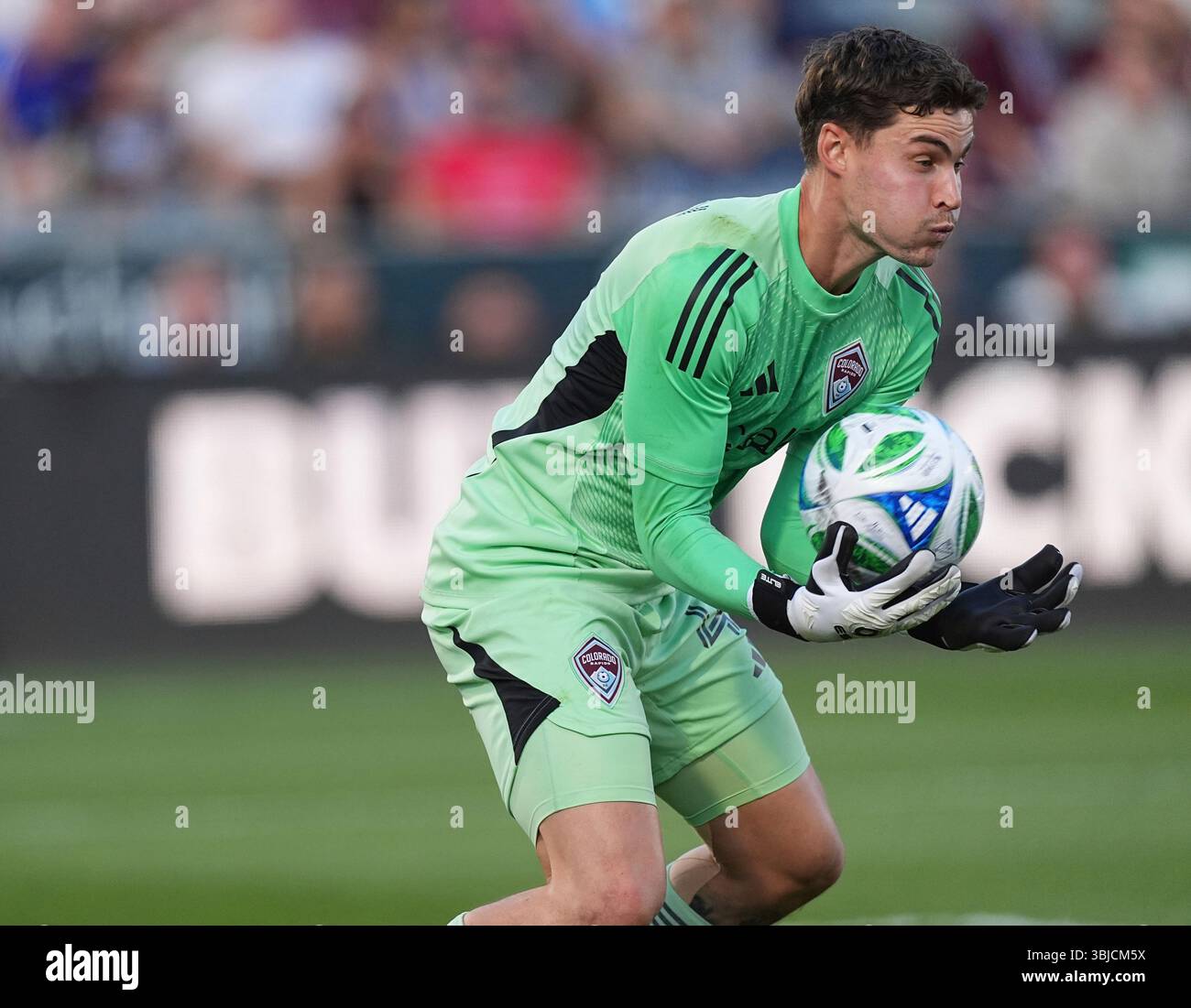 Colorado Rapids goalkeeper Nico Hansen stops a shot by Orlando City in ...