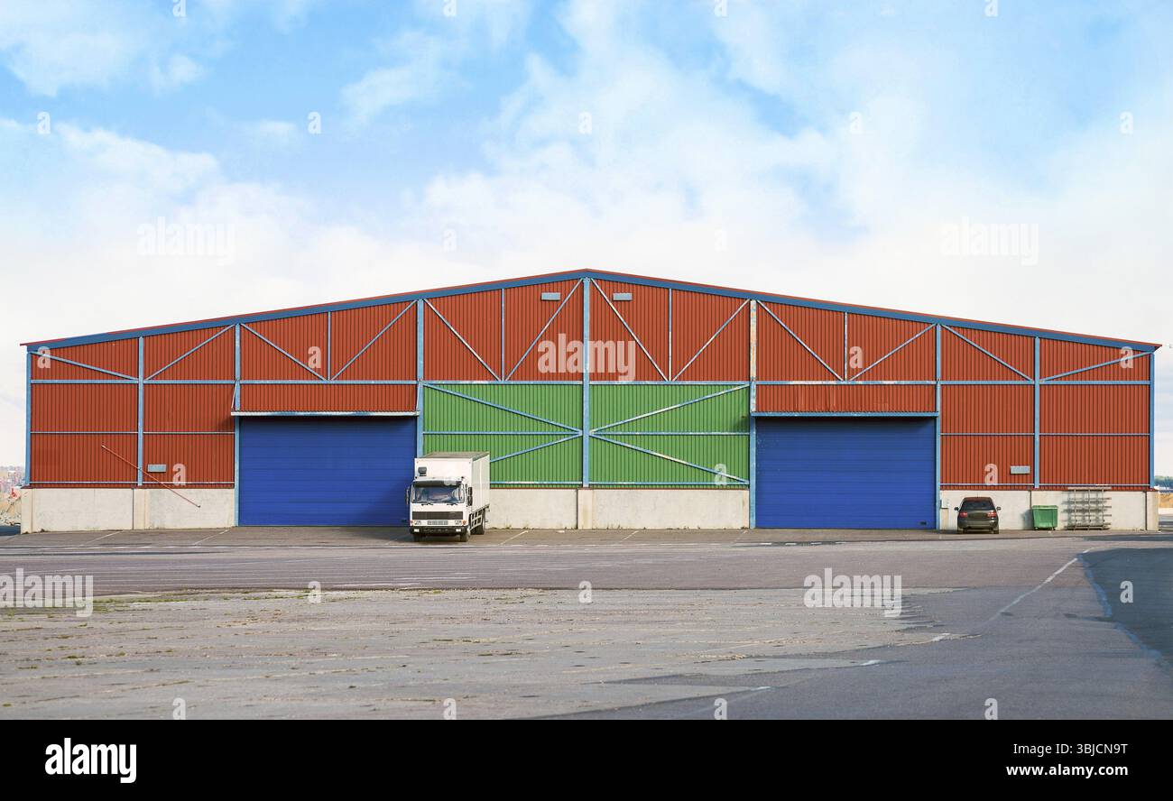 Large warehouse with two sliding gates Stock Photo - Alamy