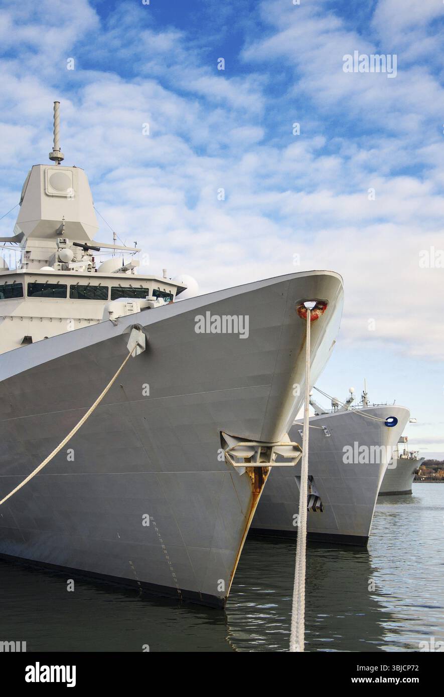 Three naval ships moored in dock Stock Photo - Alamy