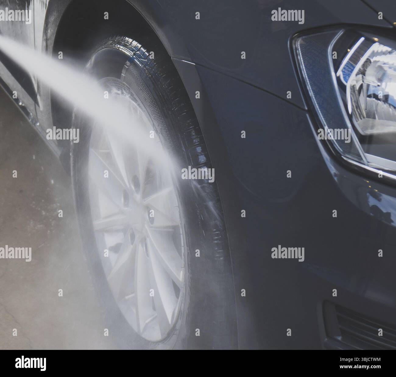 Car wash using high pressure water jet Stock Photo - Alamy