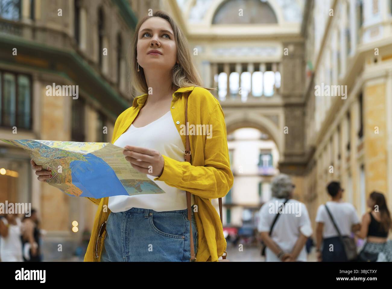 Woman tourist with map stands in the Galleria Umberto in Naples Stock ...