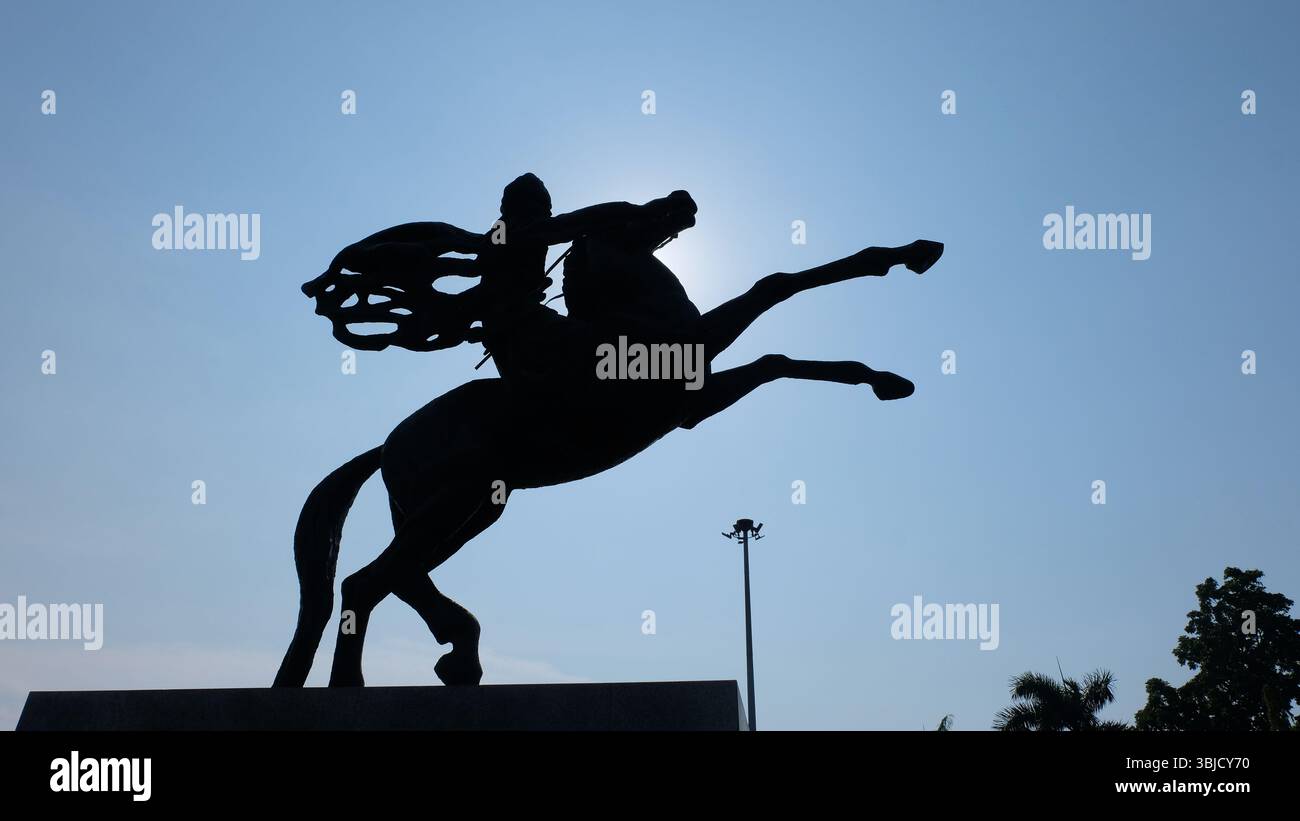 A majestic and powerful silhouette of an equestrian statue, with the ...