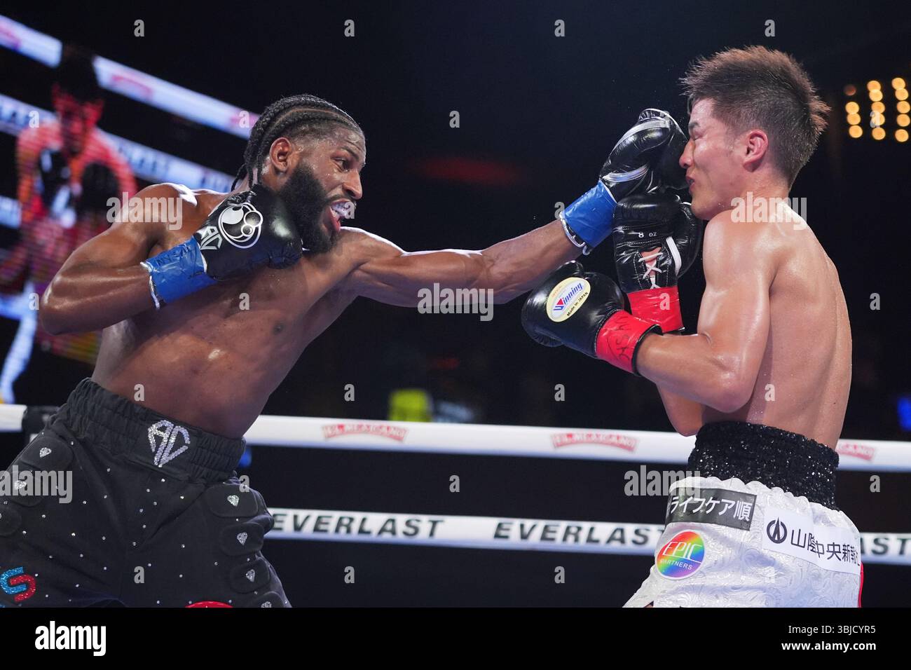 Cuba's Andy Cruz, left, punches Japan's Hironori Mishiro during the ...