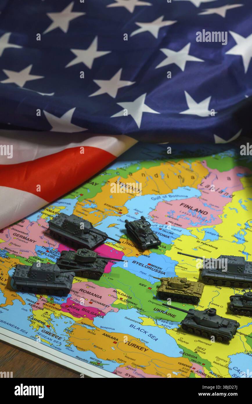 Toy tanks on the map. Concept of confrontation between NATO and Russia ...