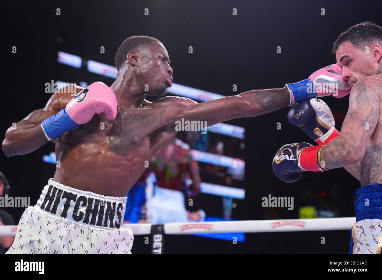 Richardson Hitchins, left, punches Australia's George Kambosos Jr ...