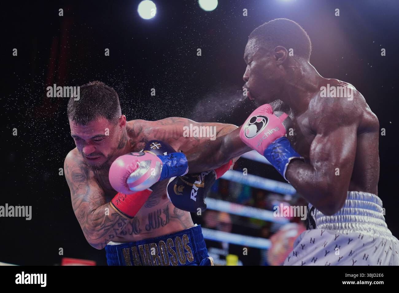 Richardson Hitchins, right, punches Australia's George Kambosos Jr ...