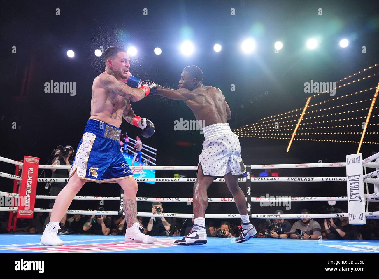 Richardson Hitchins, right, punches Australia's George Kambosos Jr ...