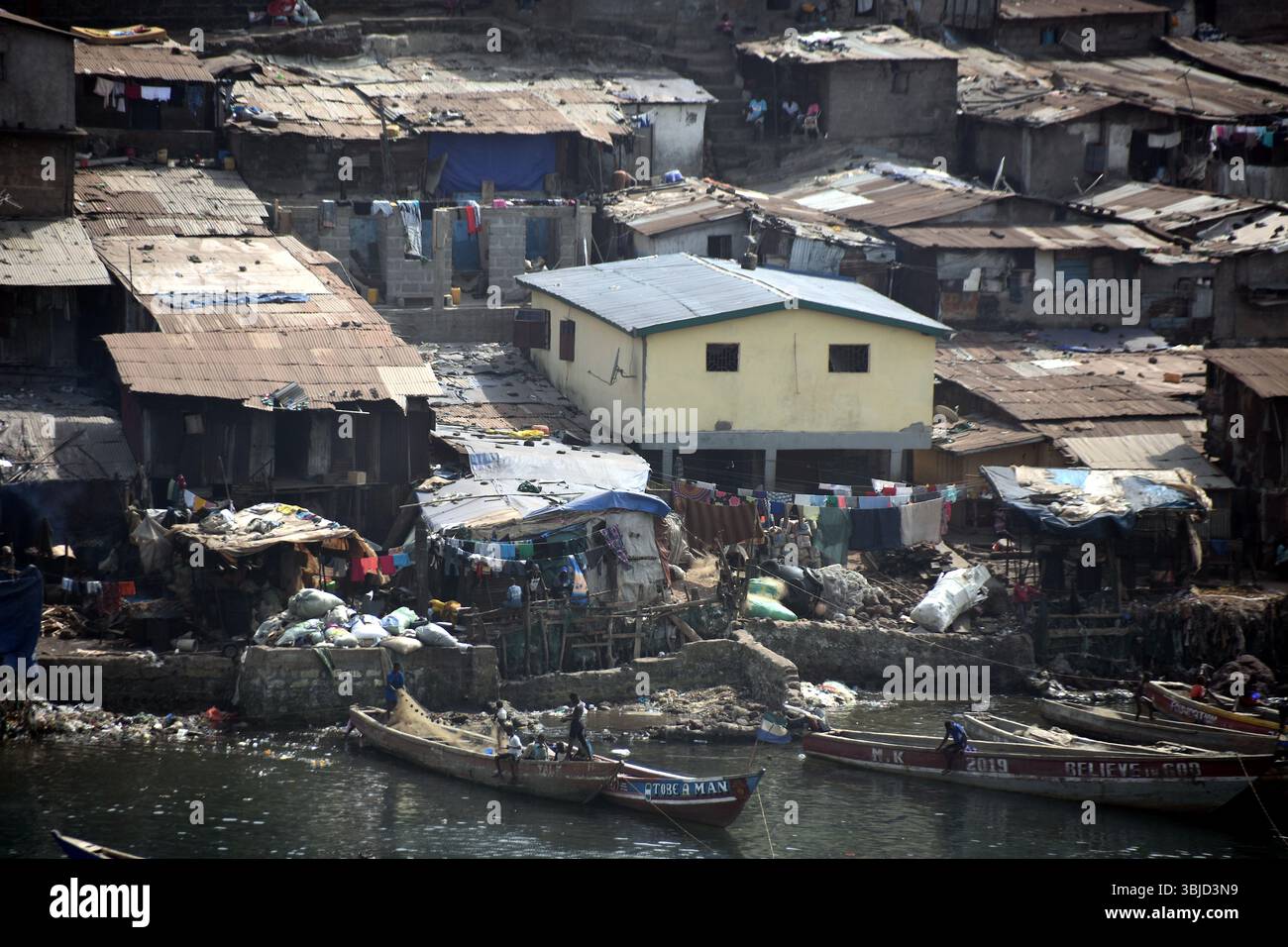 African shanty town in Freetown in Sierra Leone observed from Container ...