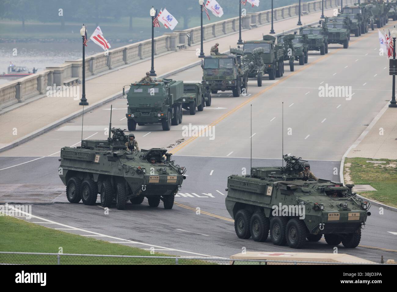 Military vehicles drive over the Memorial Bridge during a military ...