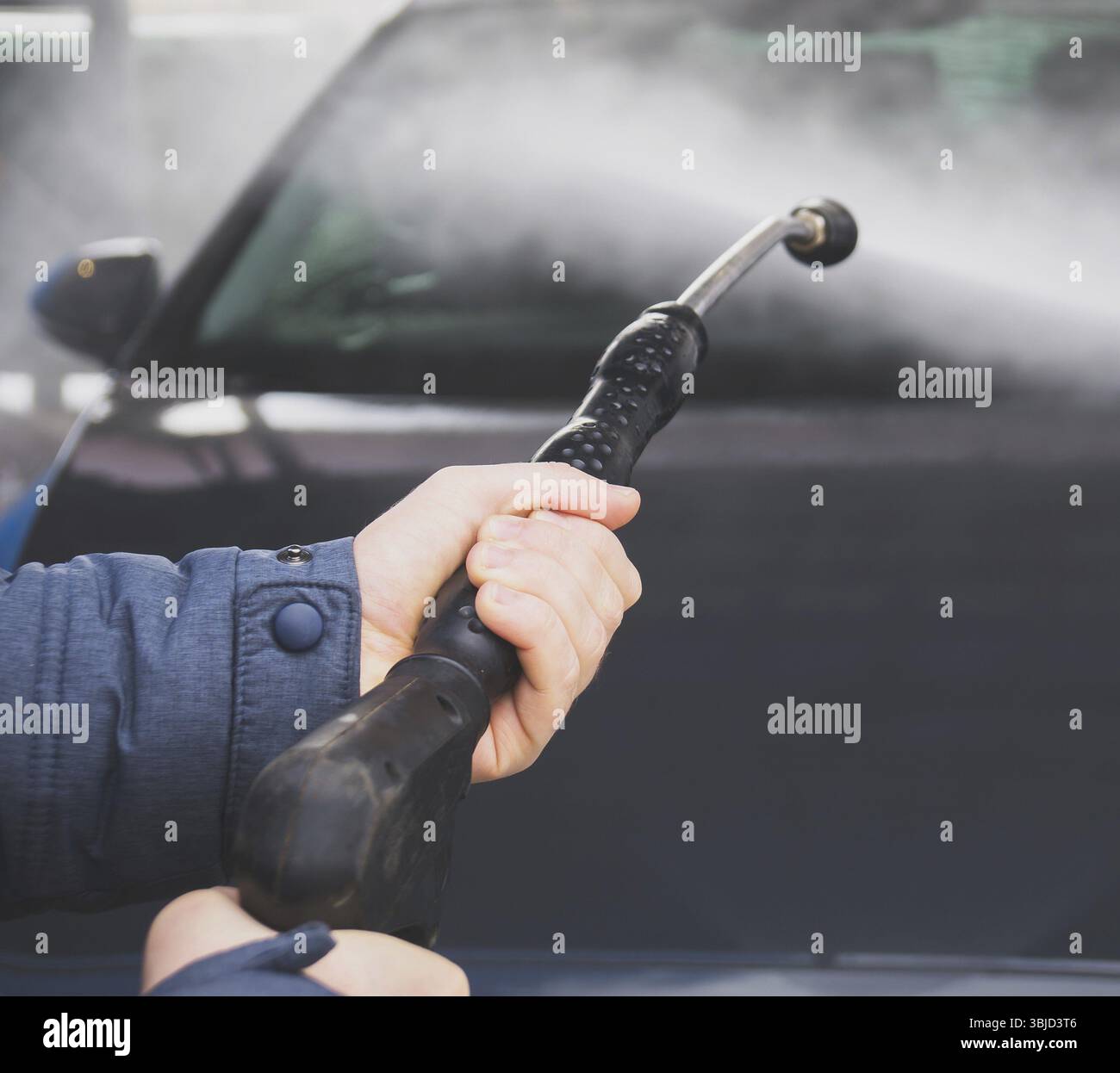 Car wash using high pressure water jet Stock Photo - Alamy