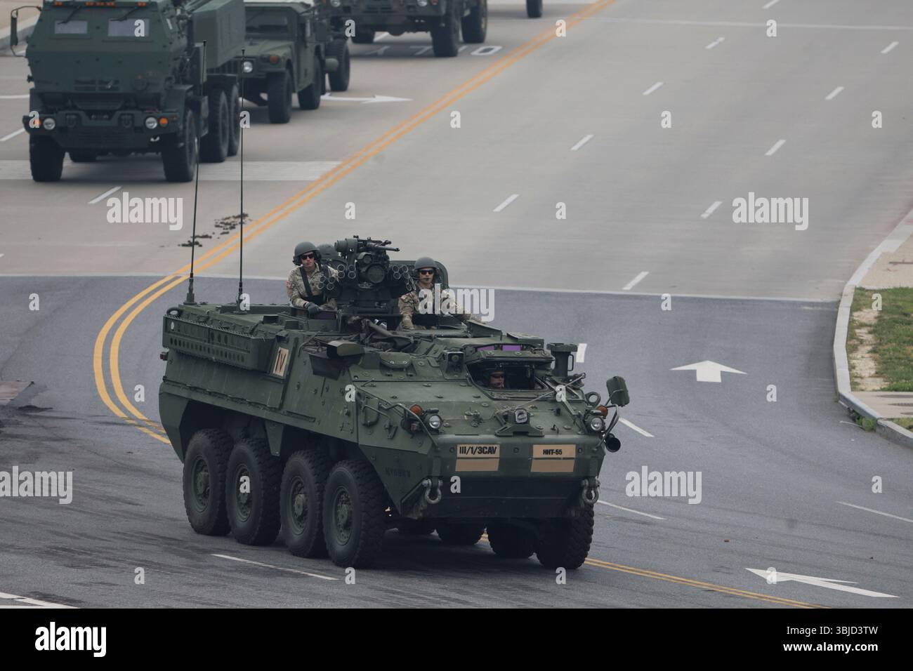 Military vehicles drive over the Memorial Bridge during a military ...