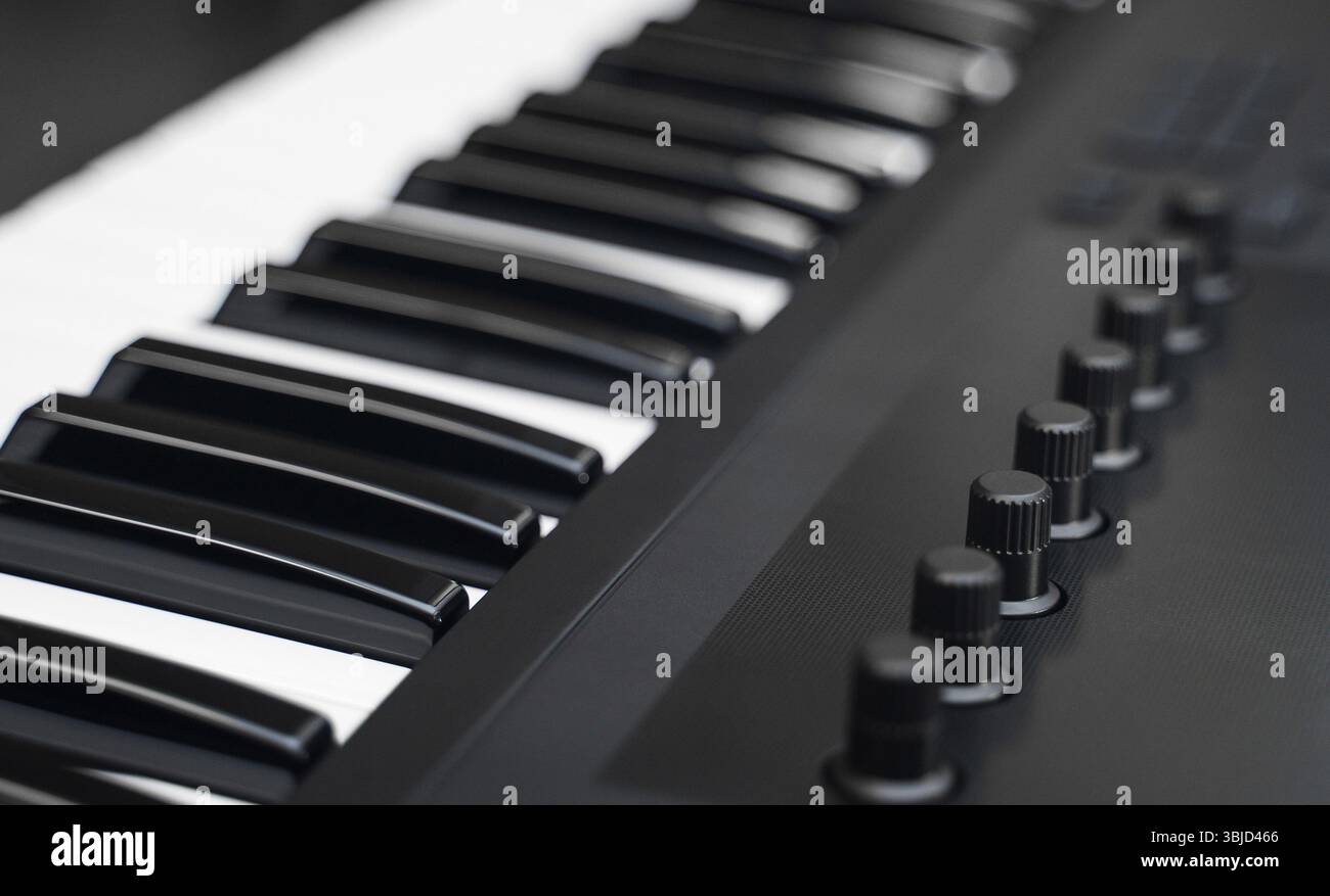Professional midi keyboard synthesizer with knobs and controllers Stock ...