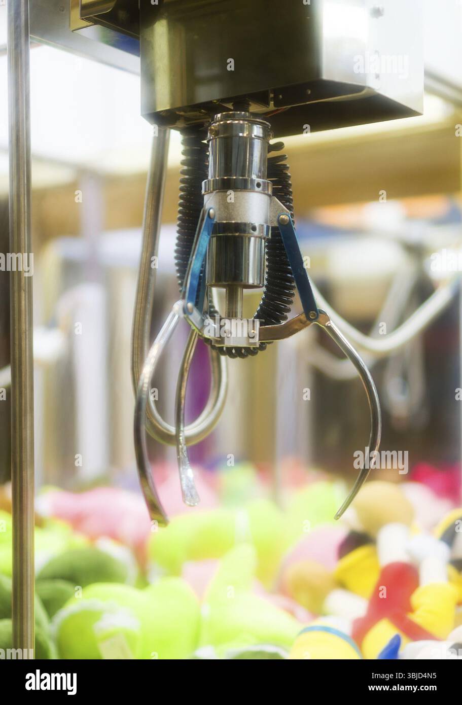 Mechanical claw game machine. Close-up view Stock Photo - Alamy