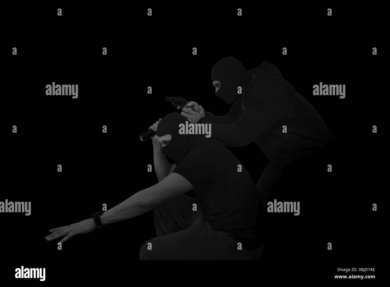 Two masked man with gun and flashlight isolated on black background ...