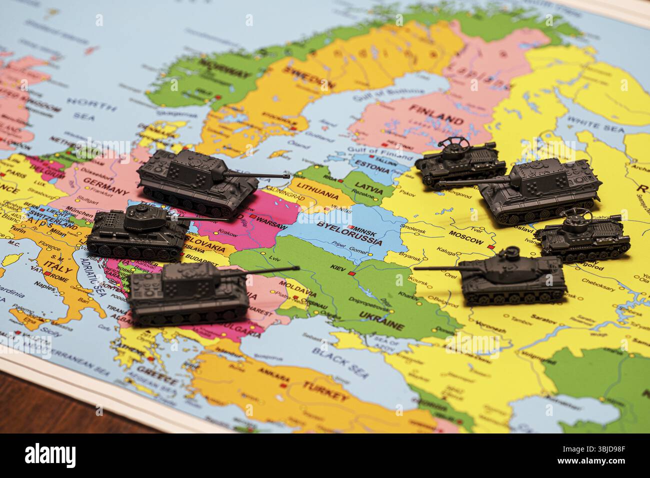 Toy tanks on the map. Concept of confrontation between NATO and Russia ...