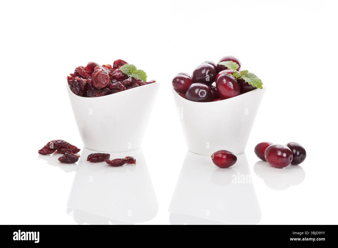 Fresh and dry cranberries isolated on white background. Healty fruit ...