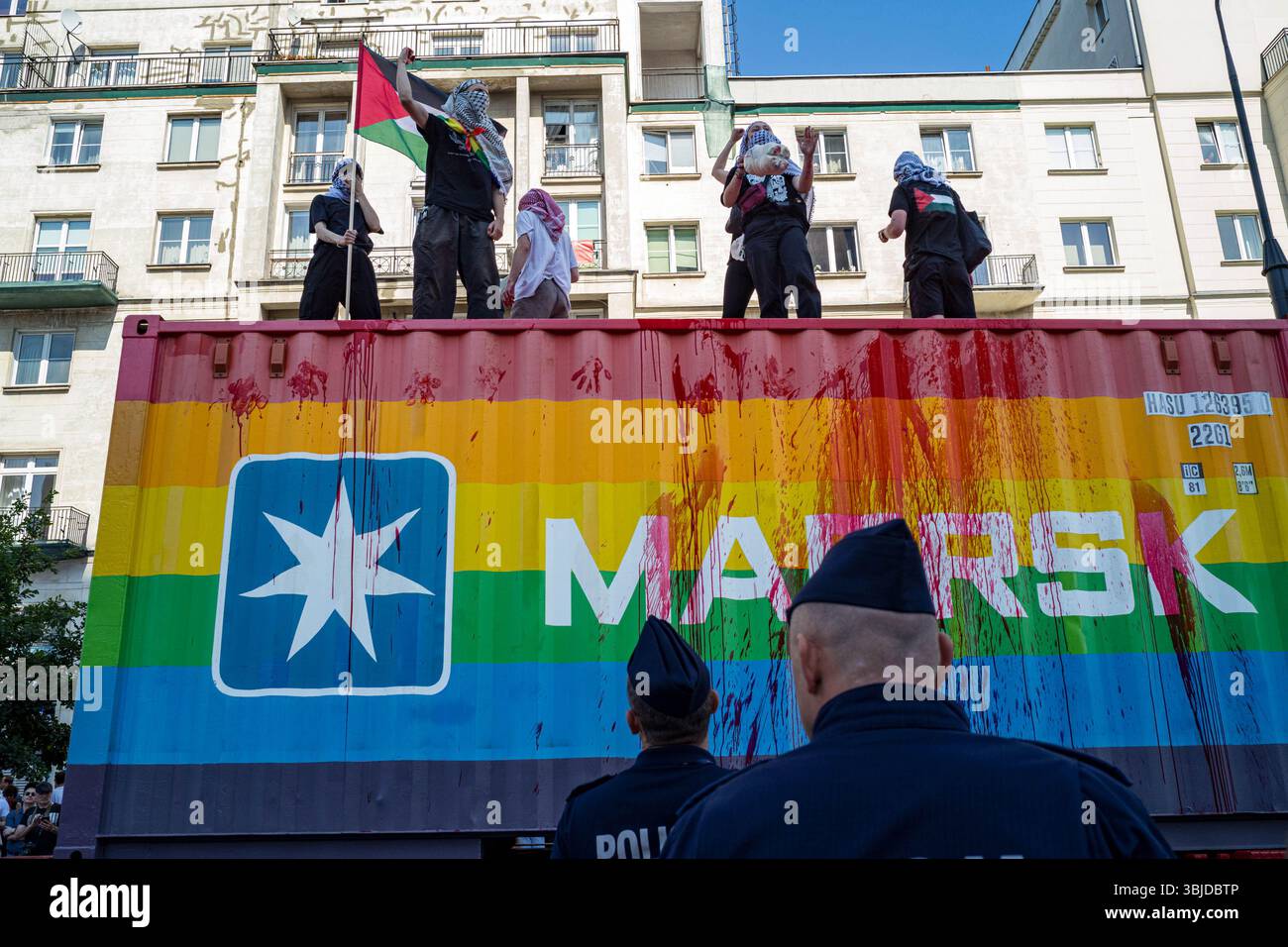 As police look on, protesters on top of the vehicle chant anti-genocide ...