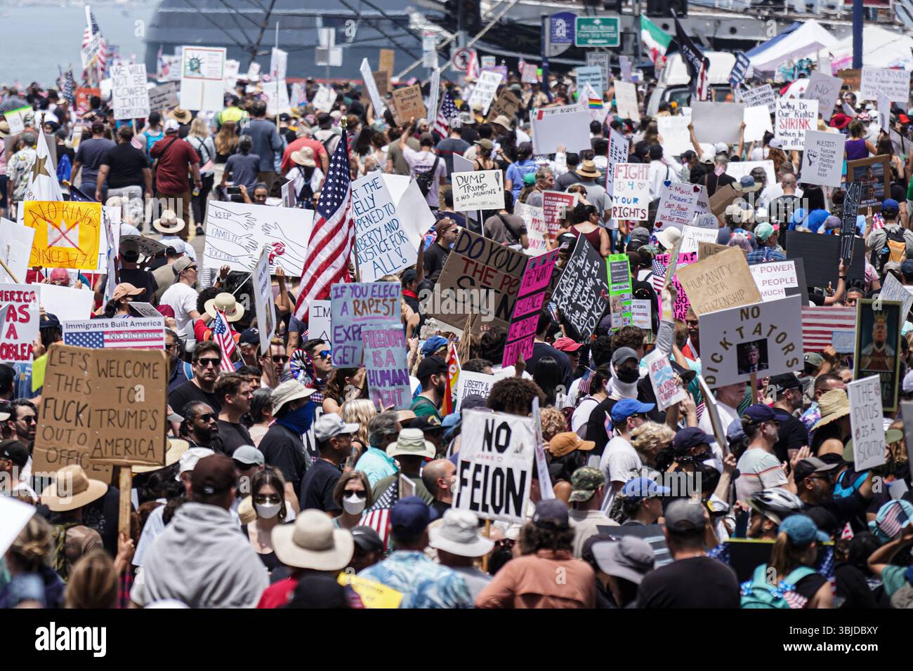 People march on the streets with placards and flags. On June 14 ...