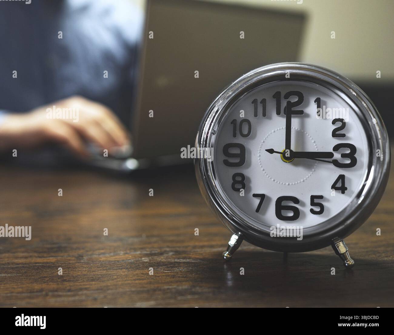 The clock shows three o'clock in the afternoon. Working hours are in ...