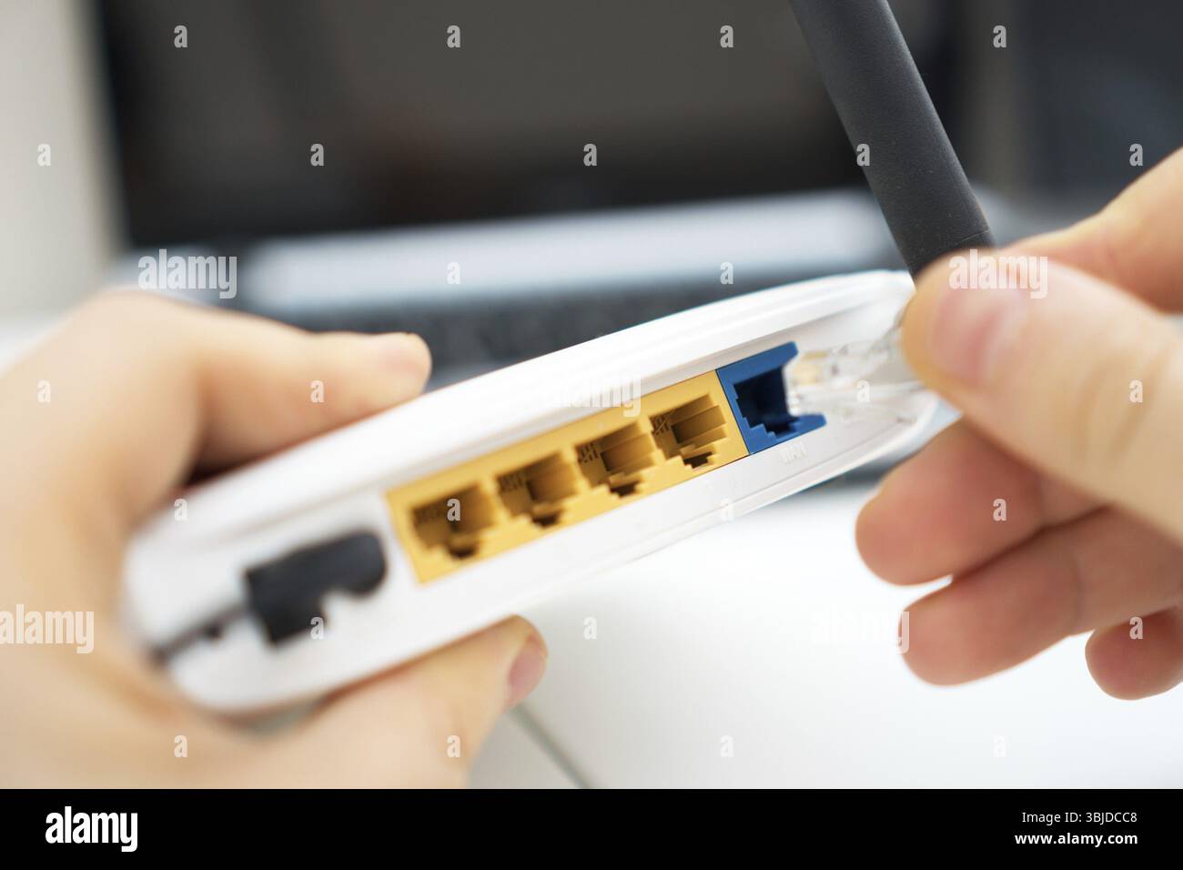 Person plugging internet cable wireless hi-res stock photography and ...