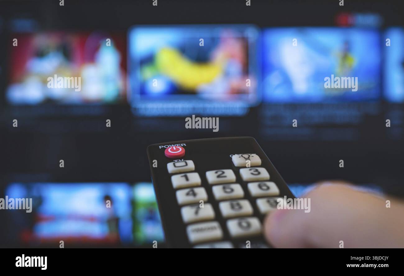 Male hand with remote control pointing on Smart TV Stock Photo - Alamy