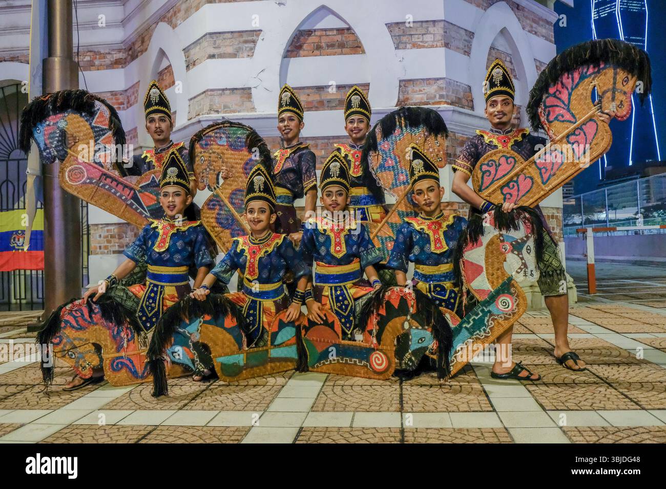 A group of Javanese traditional dancer known as Kuda Kepang pose with ...