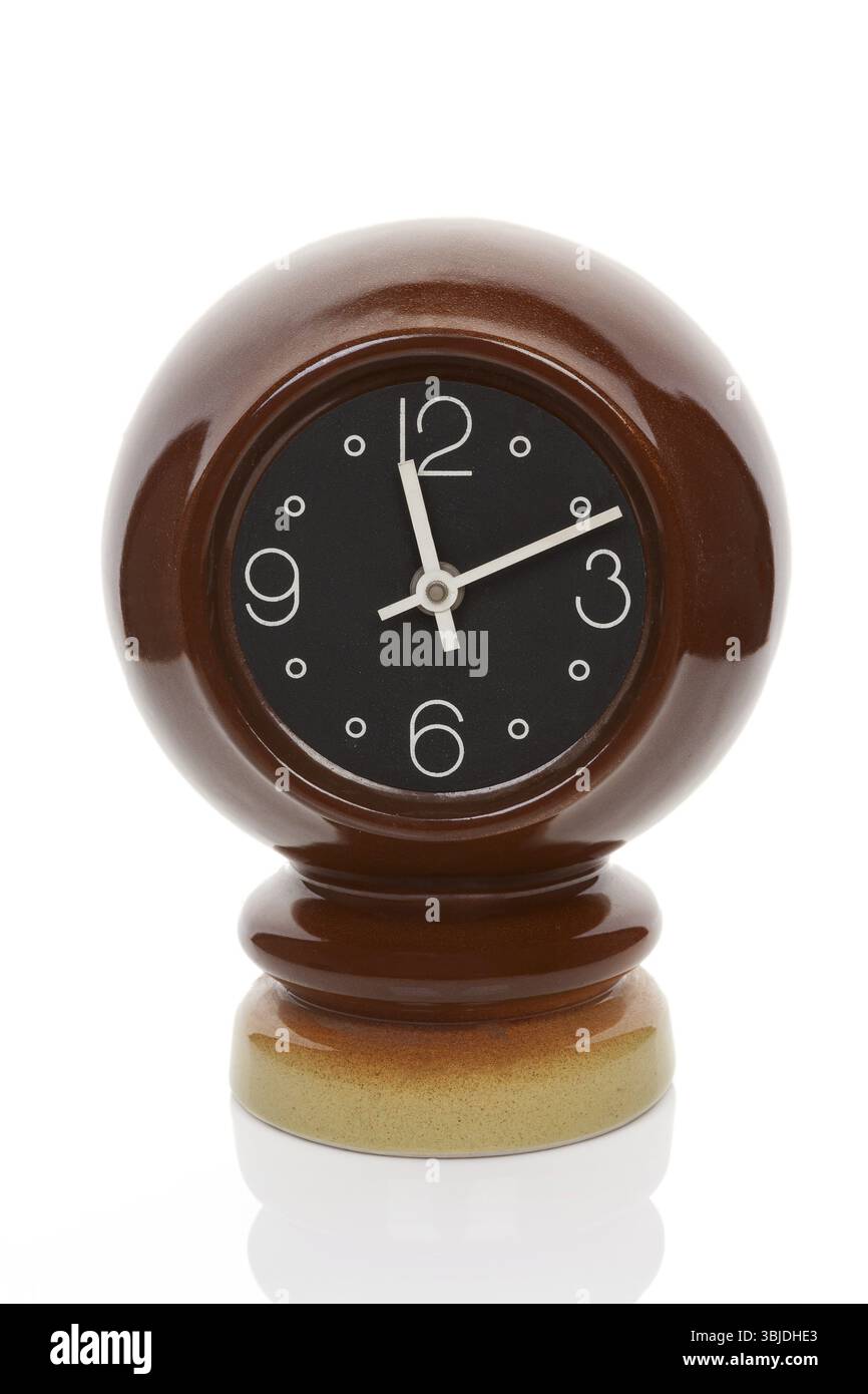 Round ceramic design retro clock from the fifties isolated on white ...