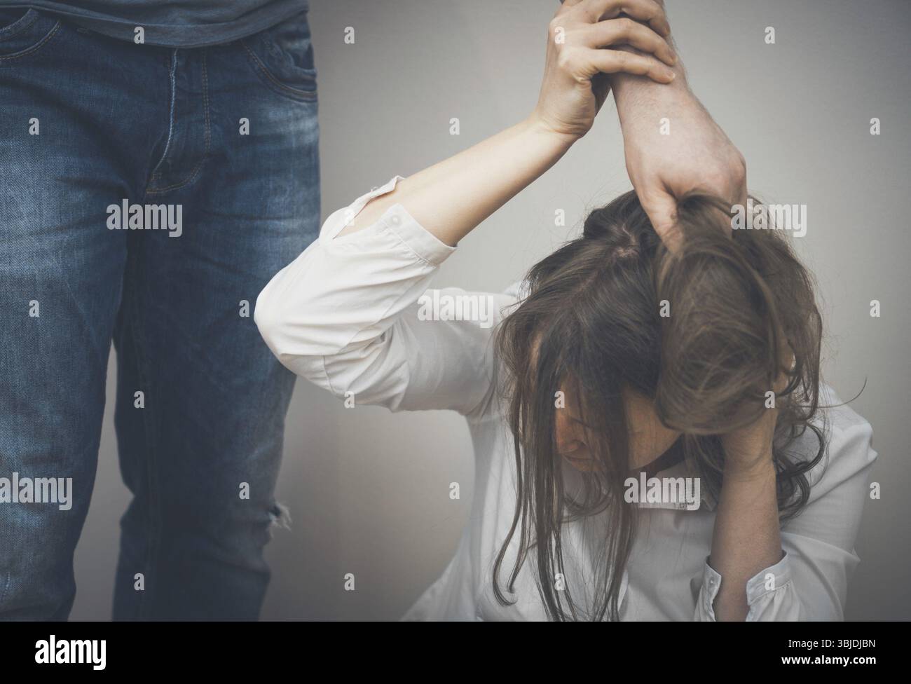 Home violence concept. Man pulling female's hair Stock Photo - Alamy