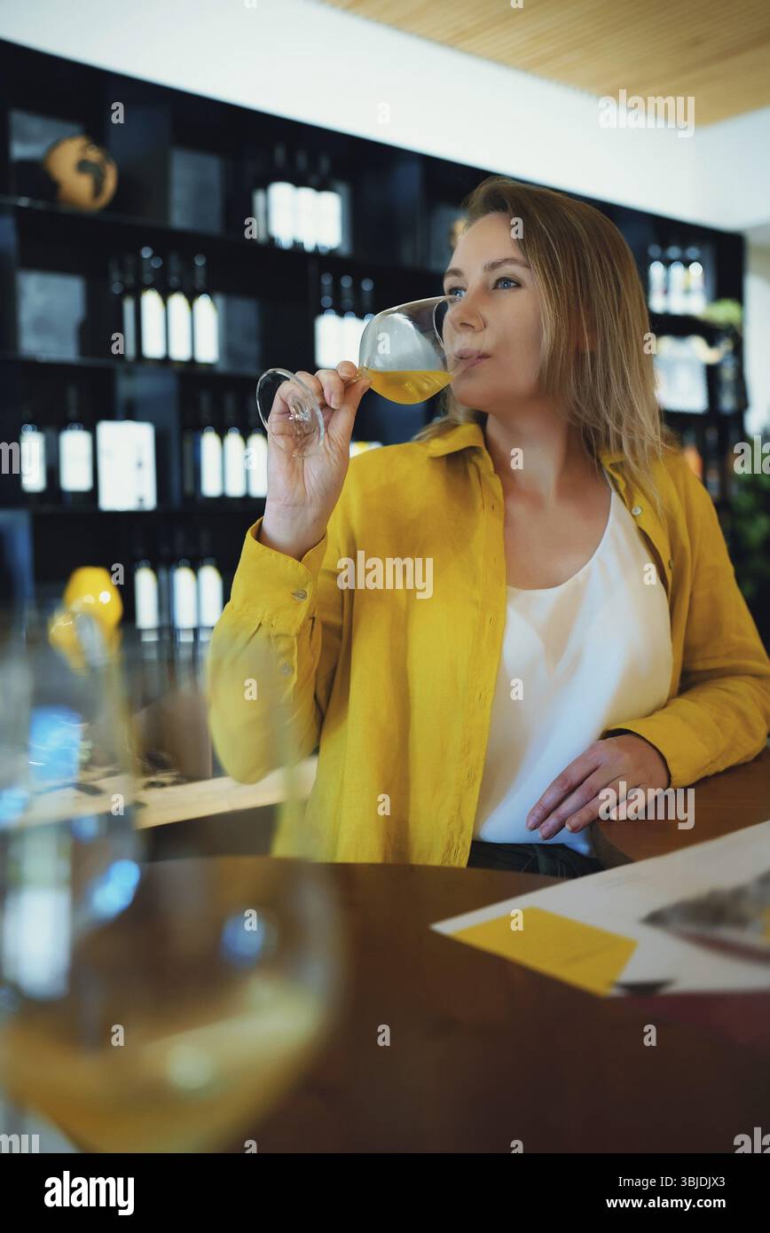 Woman tasting white wine winery hi-res stock photography and images - Alamy