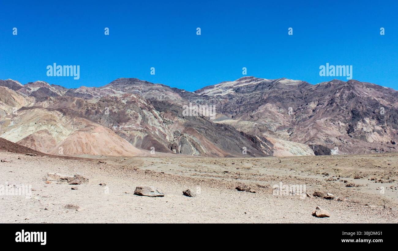 Expansive view of a desert landscape with rocky terrain and vibrant ...