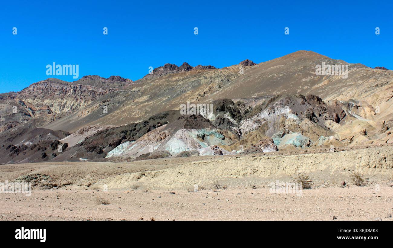Vibrant mineral layers showcase a variety of colors on the rugged ...