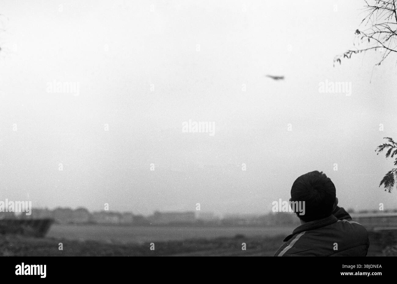 Early-2010s China Man Watching Fighter Jet Takeoff - Skyward Gaze over ...
