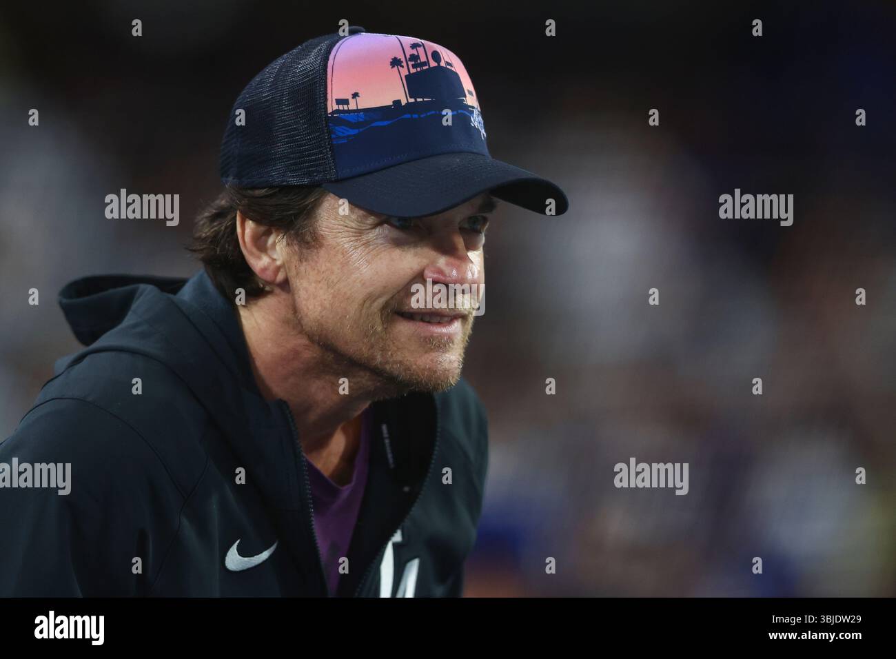 Actor Jason Bateman reacts while watching game play between the Los ...