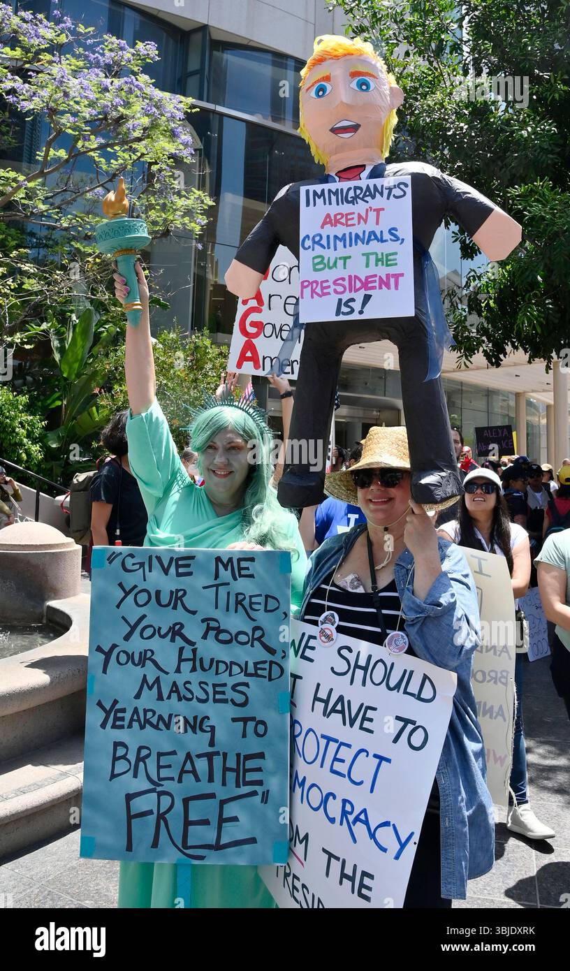 Thousands of protesters march to protest the policies of the Trump ...
