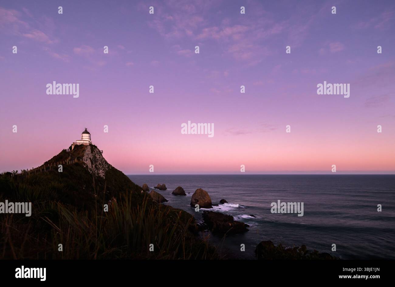 Nugget Point Lighthouse at sunset. Catlins Coast. Otago. South Island ...