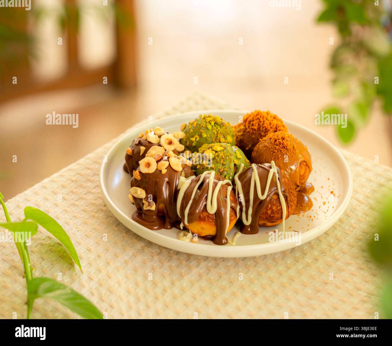 Assorted Luqaimat dessert plate with chocolate, lotus spread, and ...
