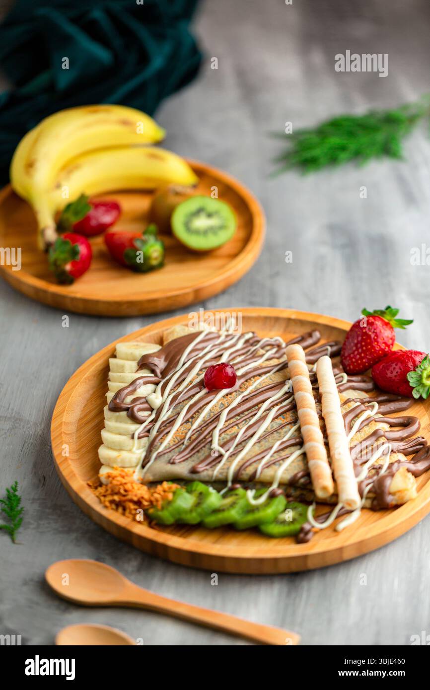 Chocolate crepe, premium Western dessert served with fresh fruits and ...