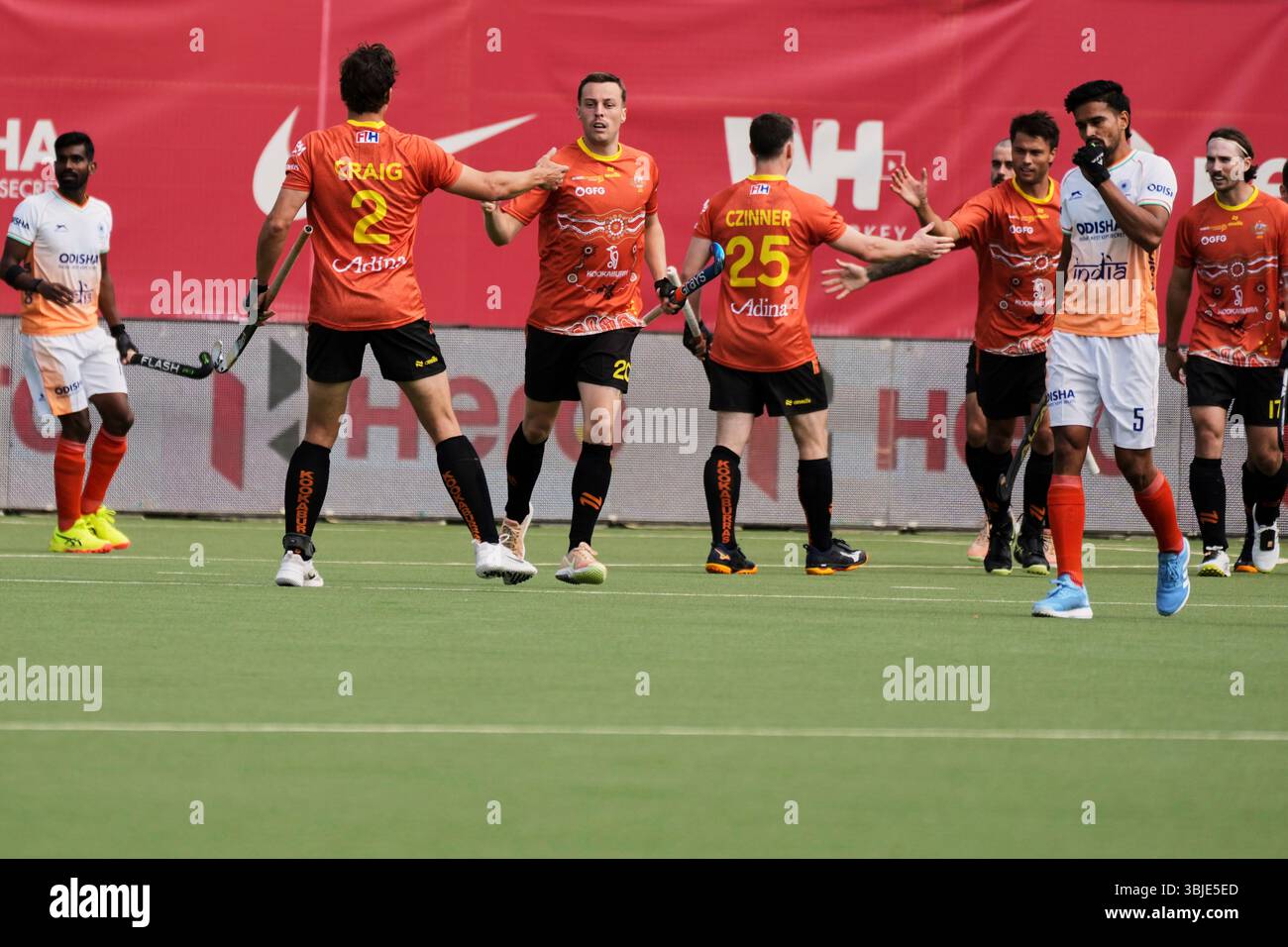 Players celebrate after Australia's Tim Brand scored during the FIH ...