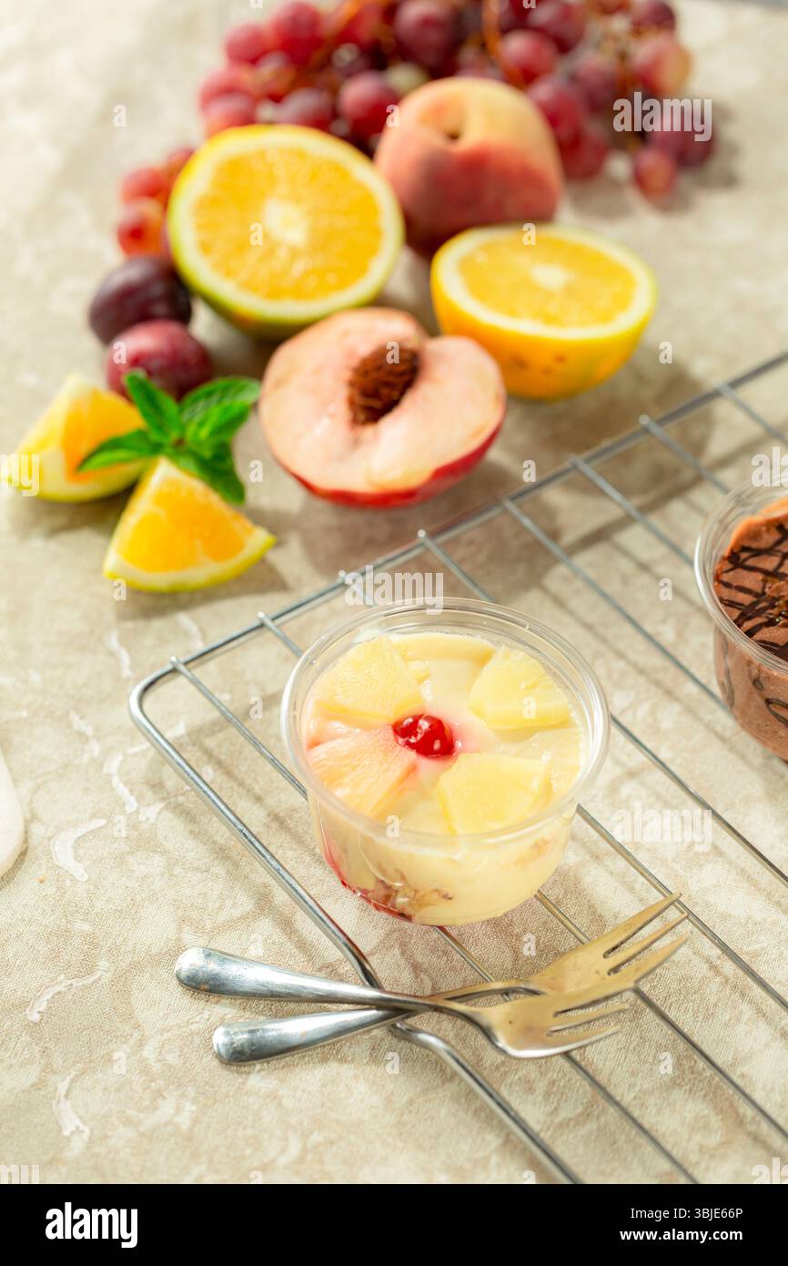 Custard dessert with fresh fruits, cold cream-based Western sweet Stock ...